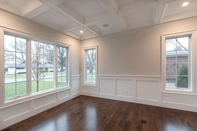 Library with wainscotting & coffer ceiling - Mark Adler Custom Homes